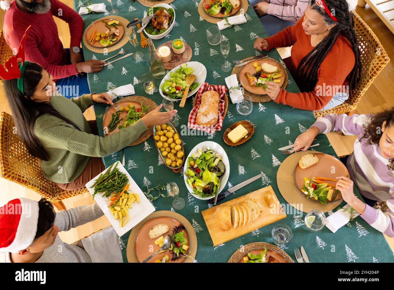 Multiracial family sharing festive christmas dinner, at home Stock ...