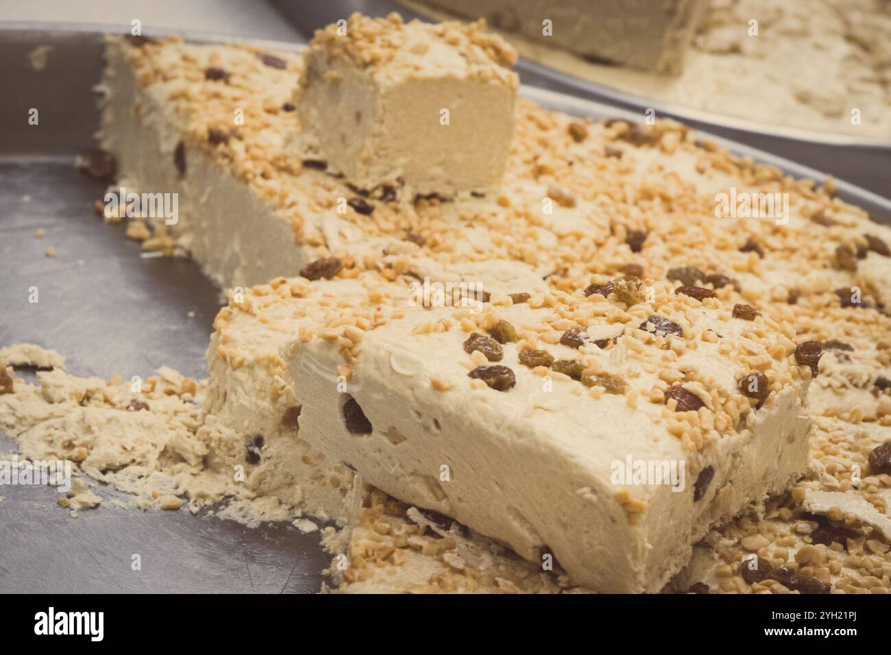 Portion of halva with nuts on stall at bazaar. High calorie snack Stock ...