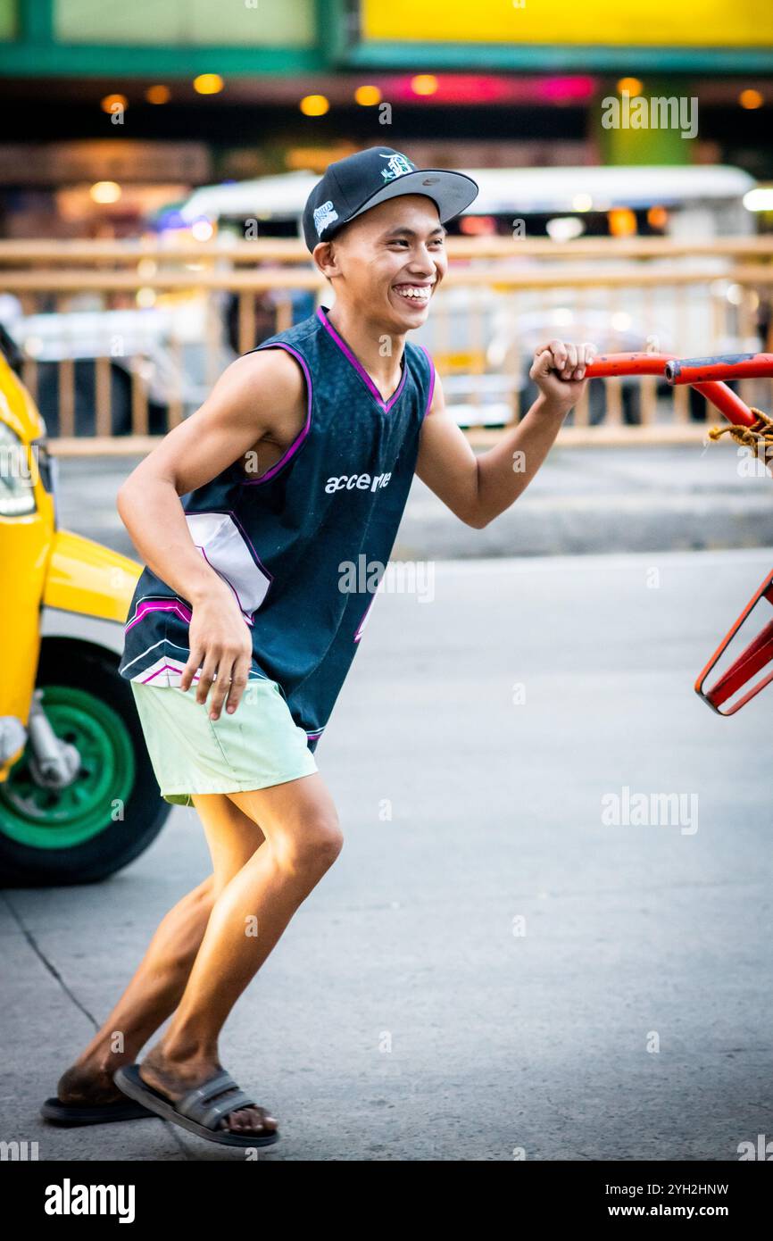Man pulling trolley hi-res stock photography and images - Alamy