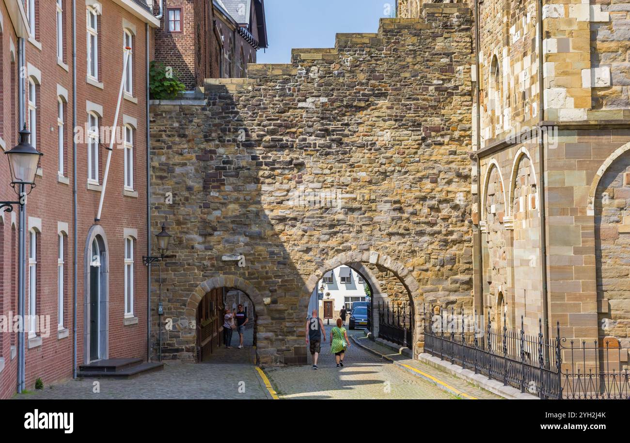 People walking through the arches of the Servaas church in Maastricht ...