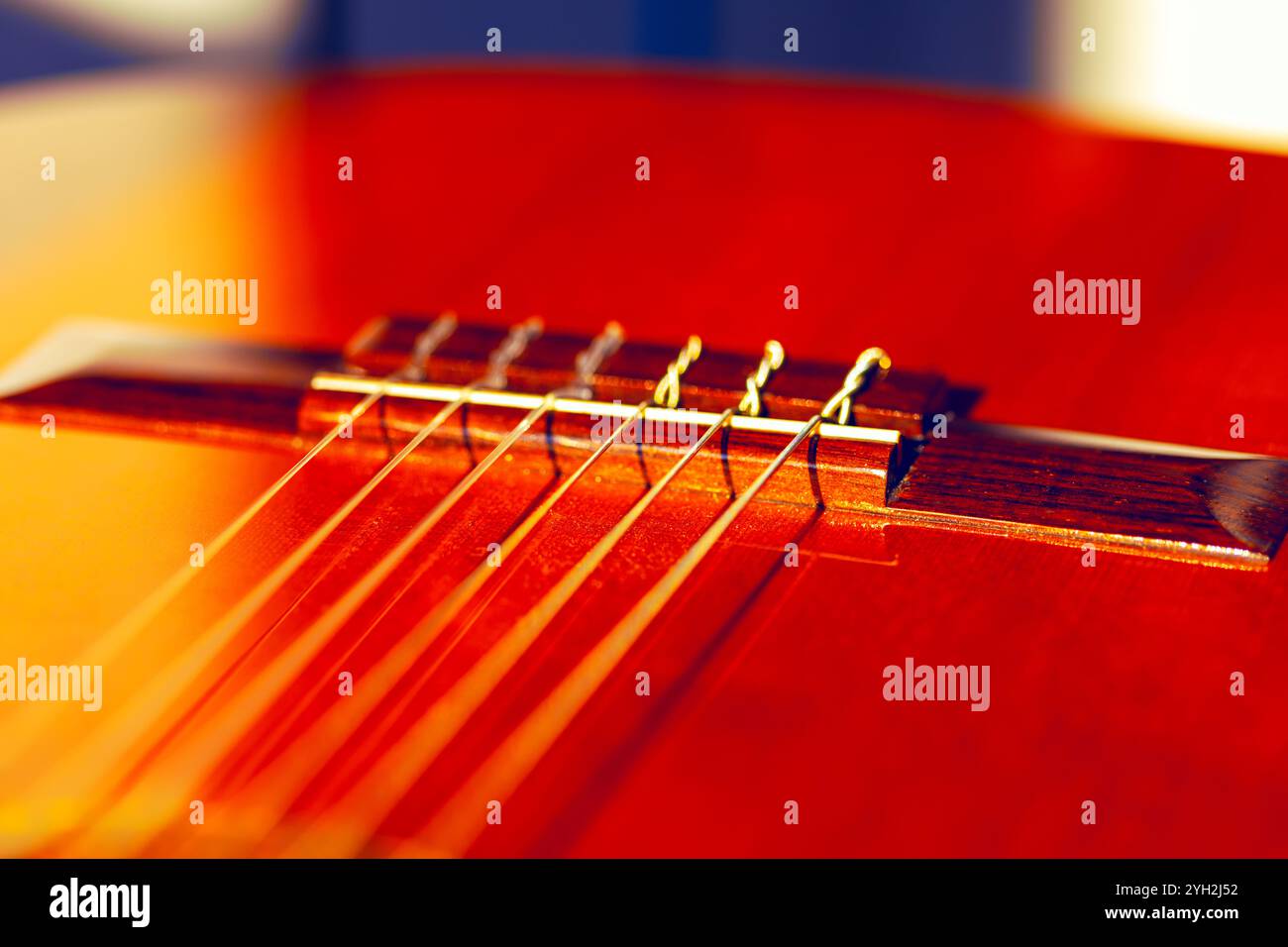 Classical guitar closeup, wooden surface with strings. Guitar ...