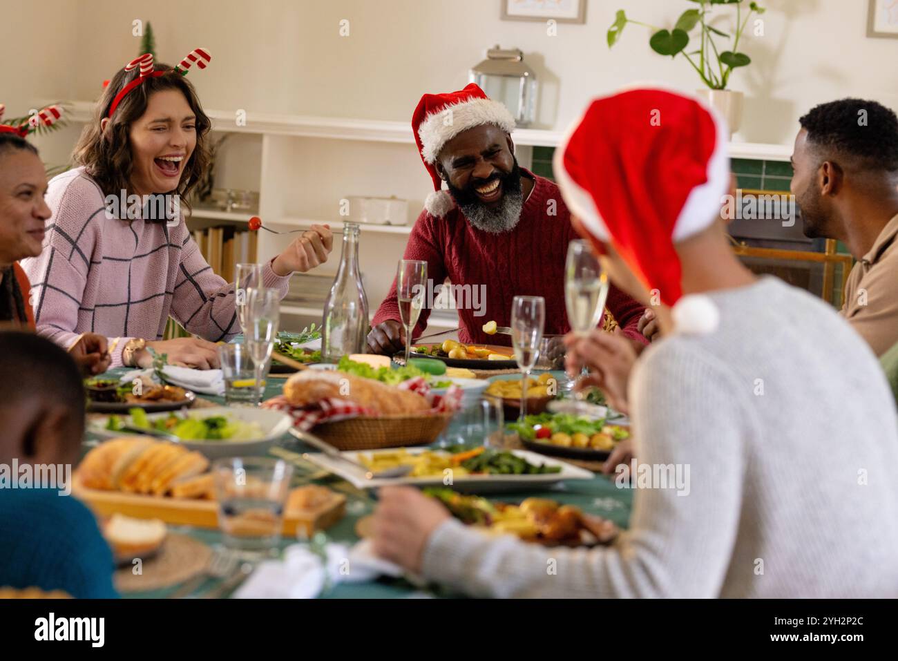 Celebrating Christmas, diverse multiracial family sharing festive ...