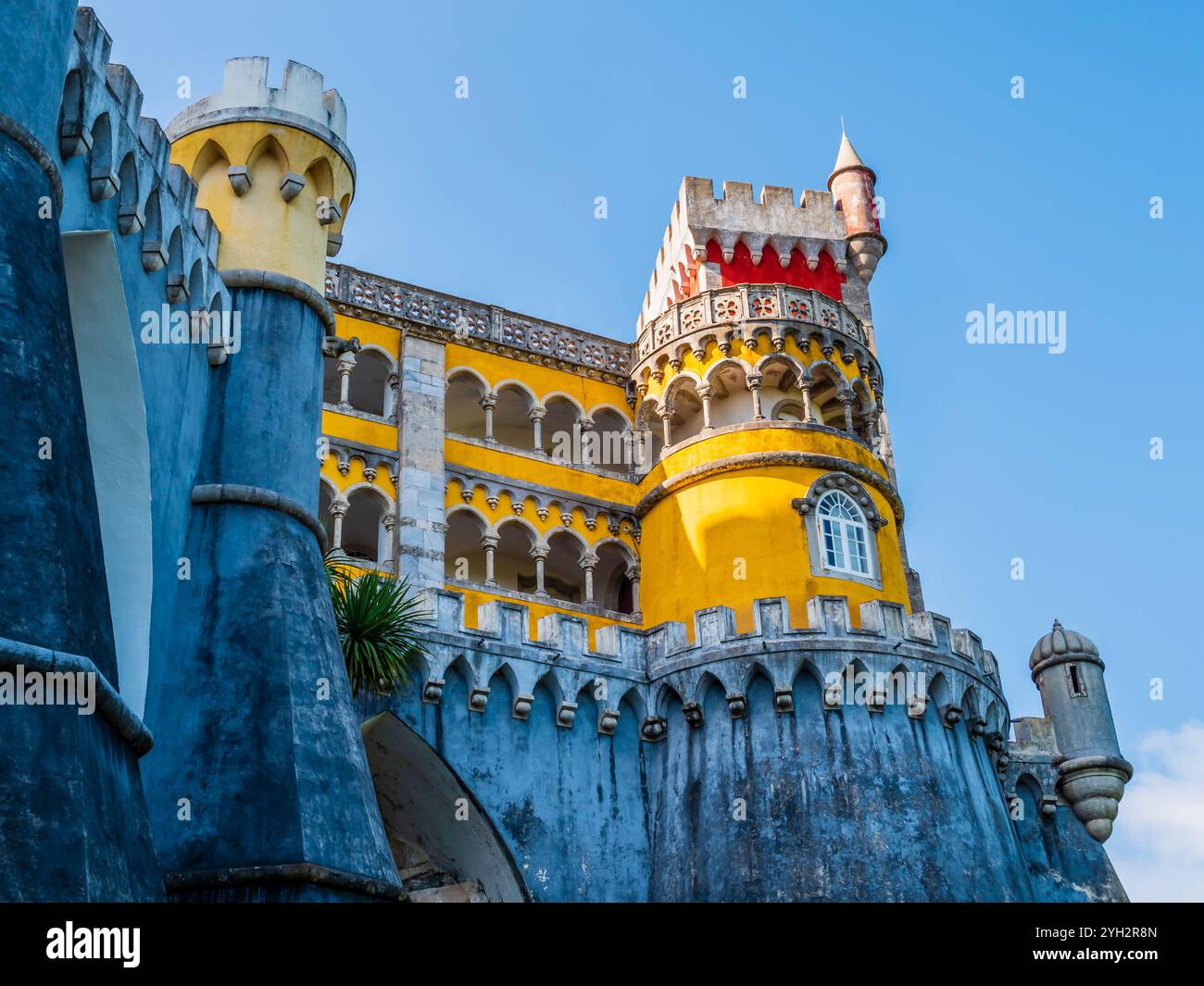 Impressive view of famous Pena Palace with the yellow arches yard and ...