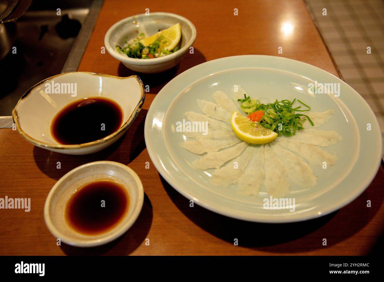 Delicate Fugu Sashimi with Dipping Sauces Stock Photo - Alamy