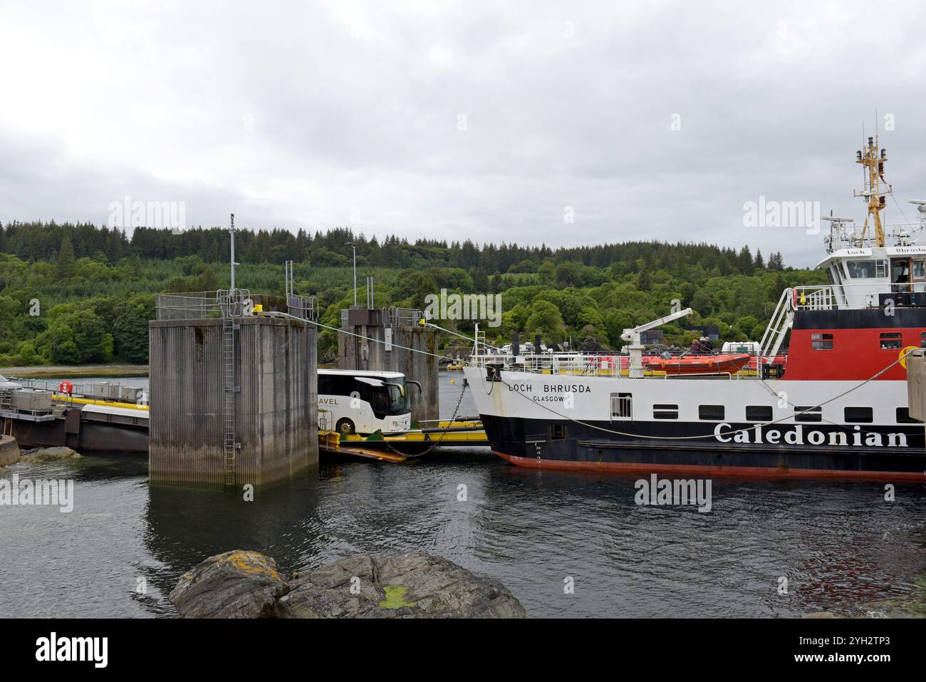 A tourist coach drives onto the Cal Mac ferry Loch Bhrusda for Mallaig ...