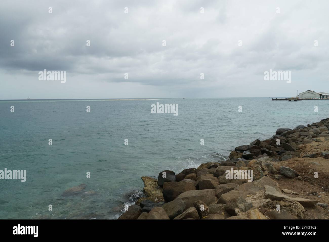 Artificial breakwater built by rocks and piled up in wave breaker to ...