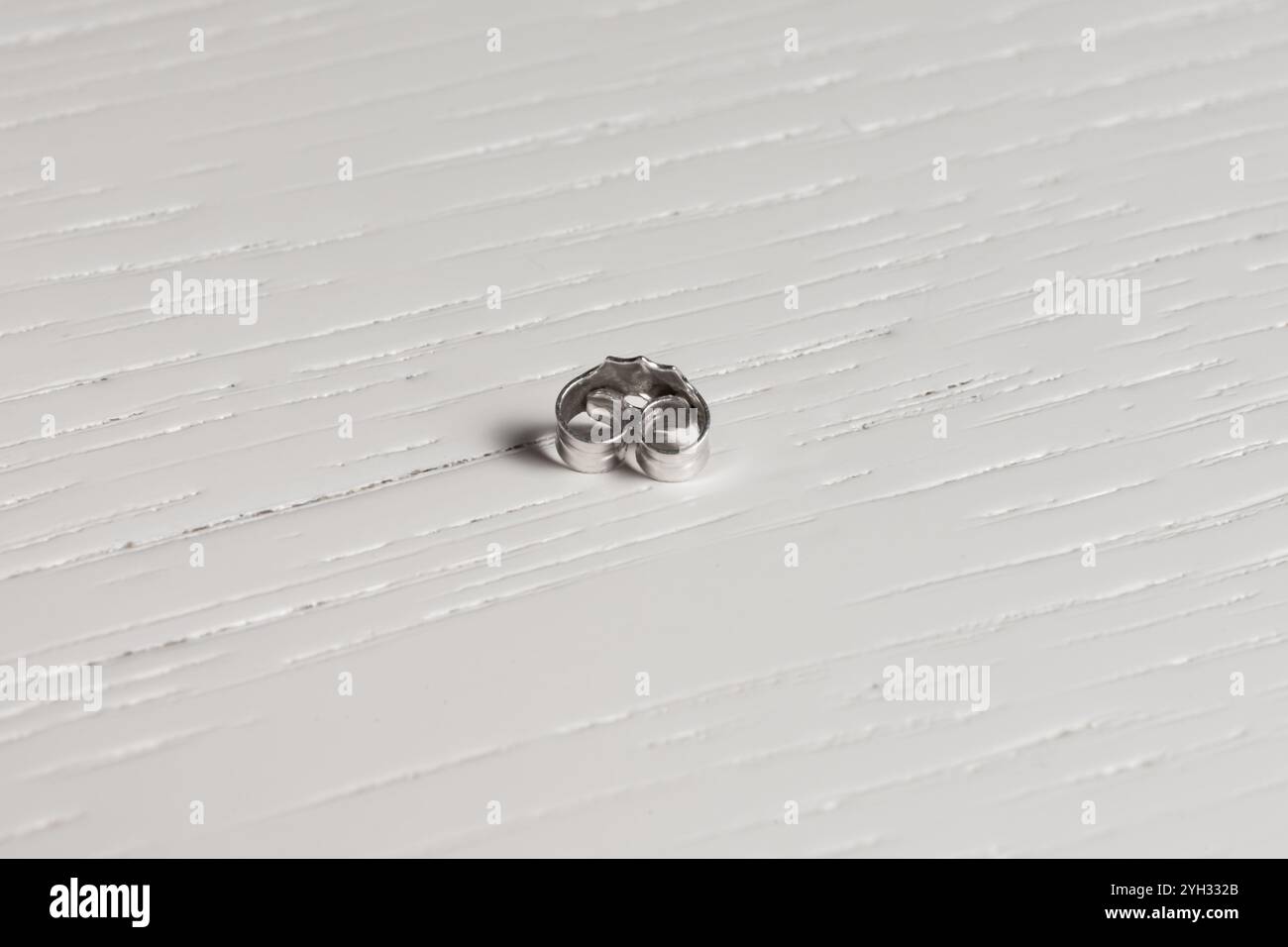 Earring clasp tension back made of 585 white gold Stock Photo - Alamy