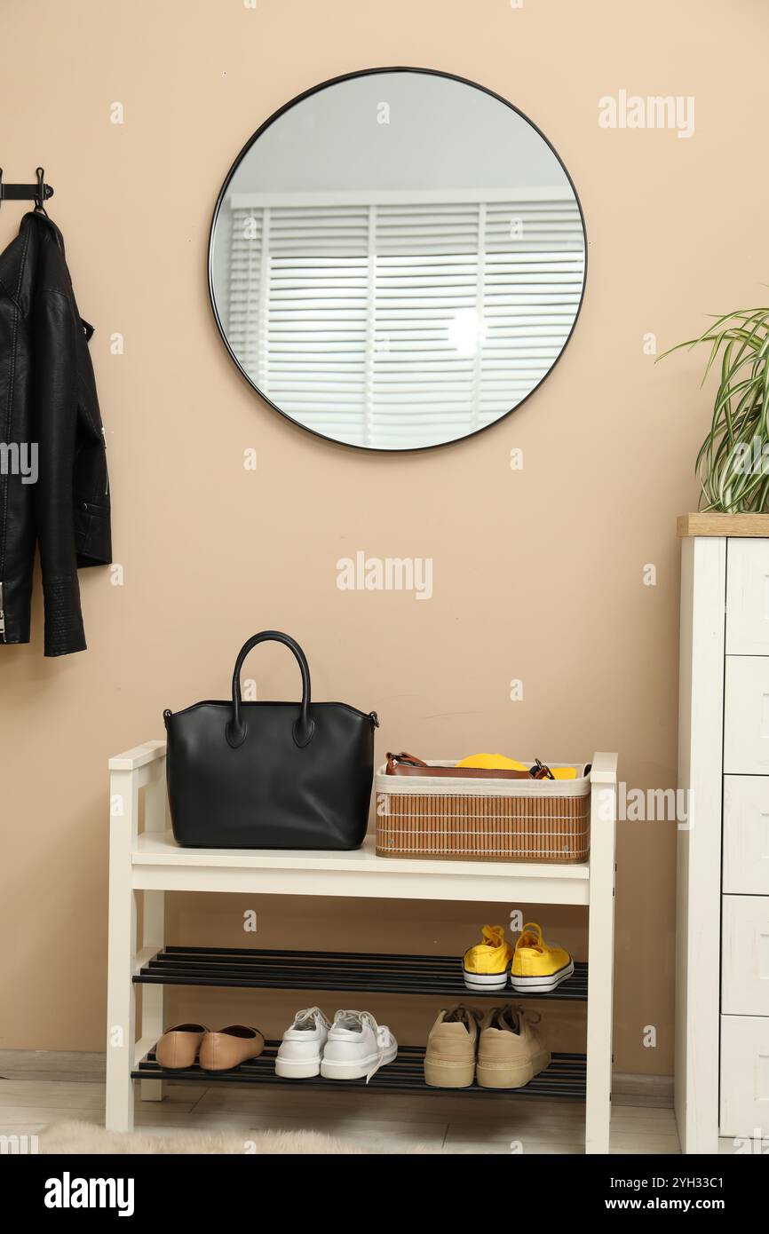 Mirror and shoe storage bench in hallway. Interior design Stock Photo ...