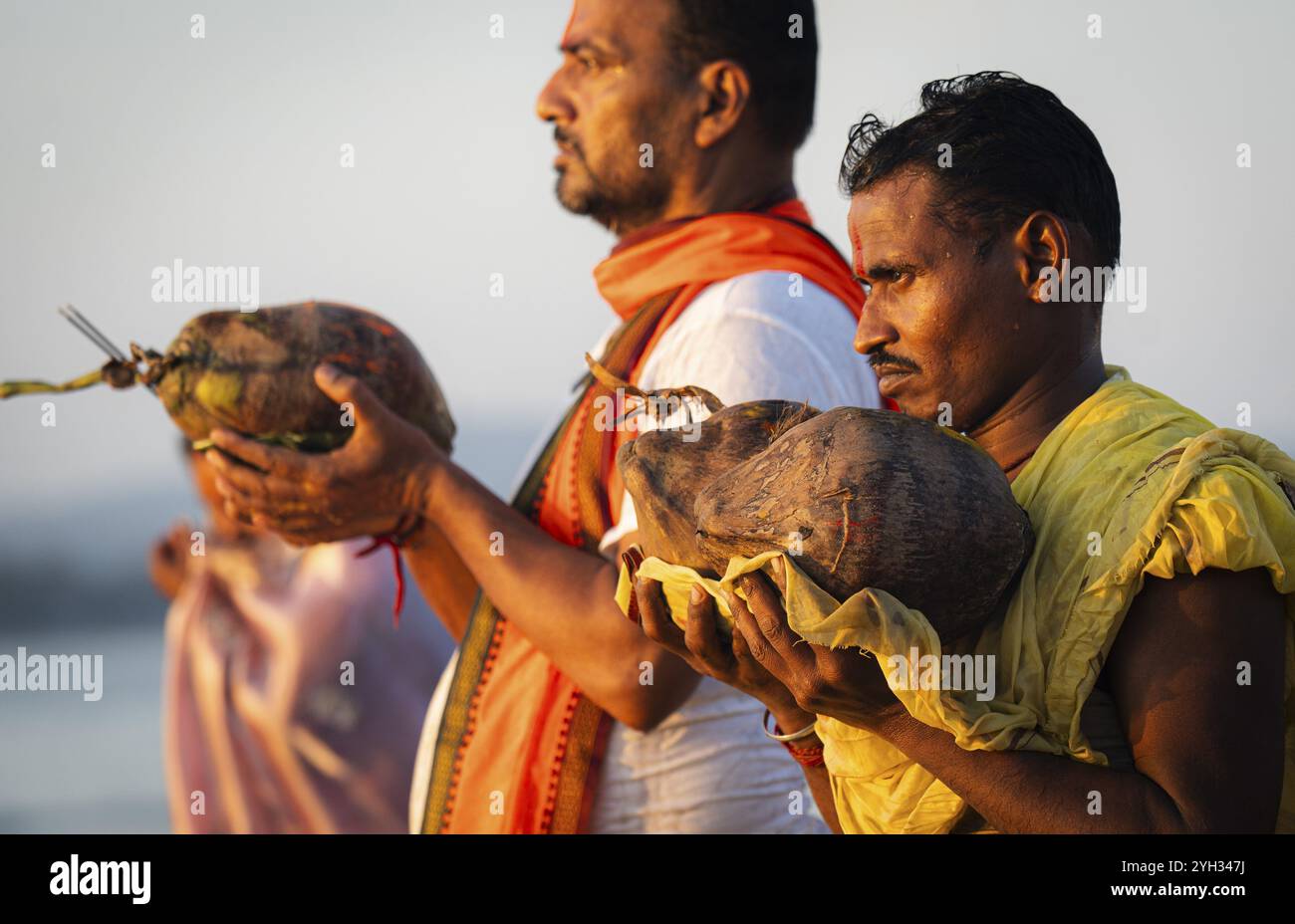 Hindu devotees perform rituals as they offer prayers to the Sun god in ...
