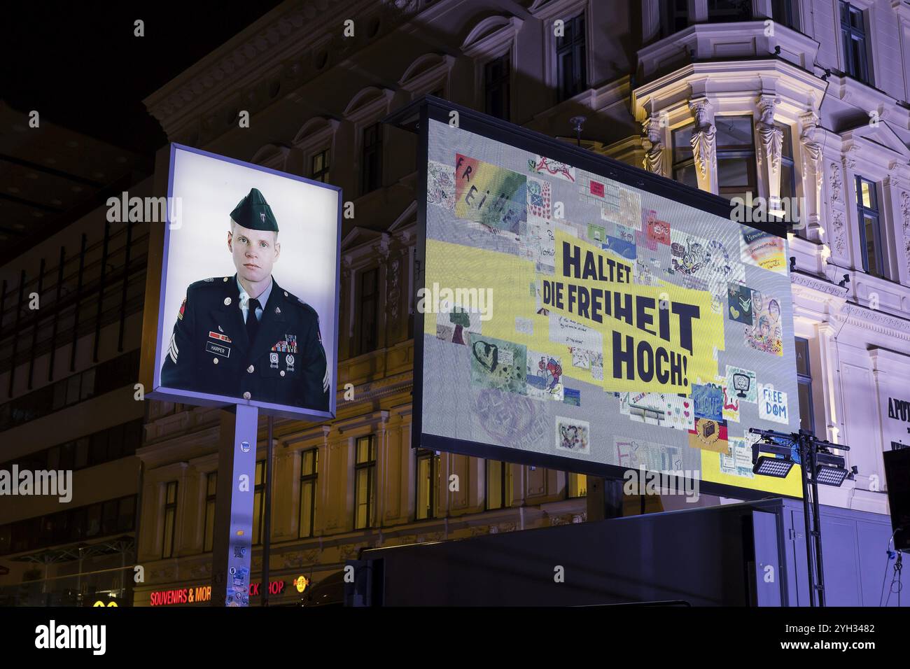 Checkpoint Charlie with large display Hold up freedom! to mark the 35th ...