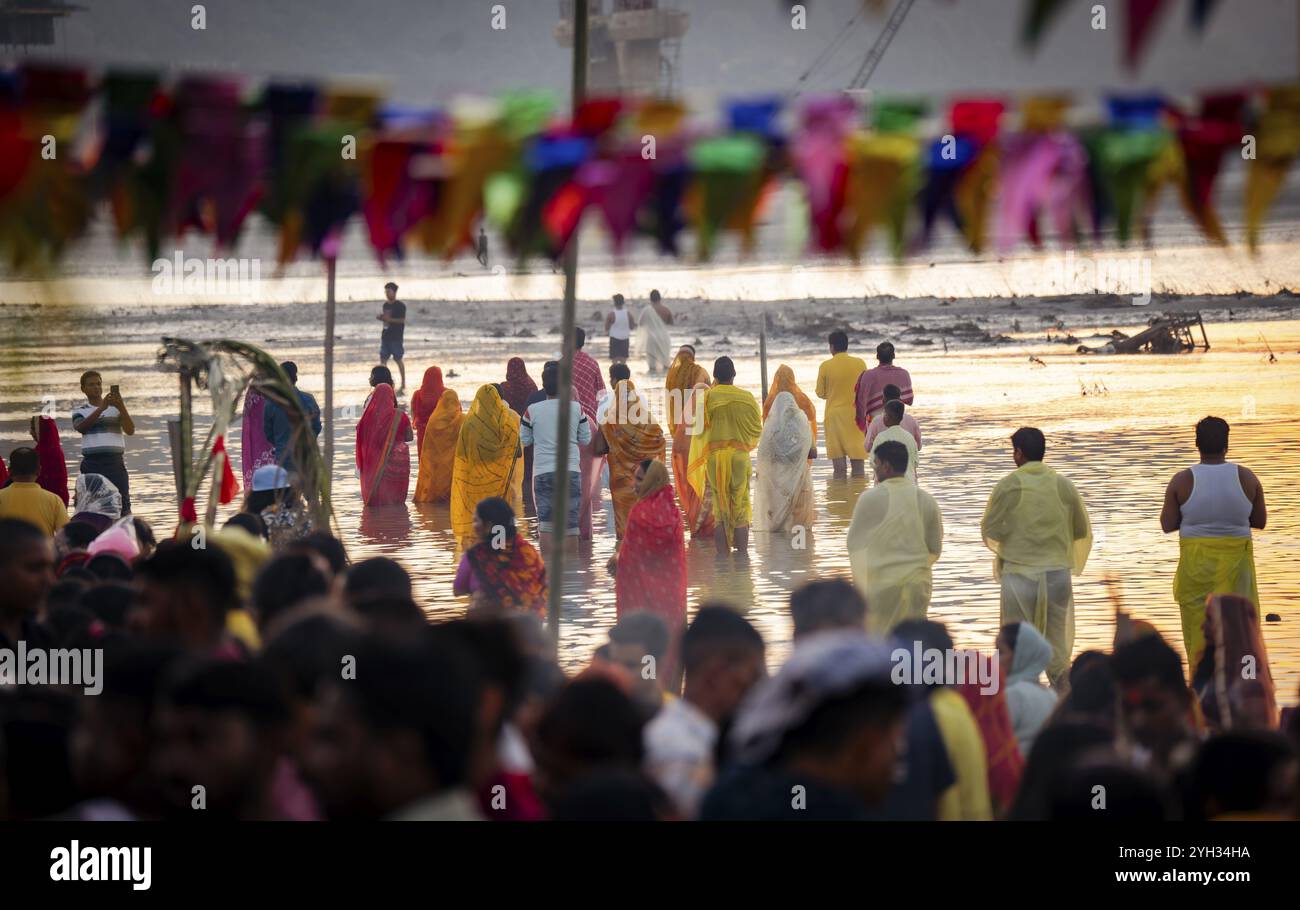 Hindu devotees perform rituals as they offer prayers to the Sun god in ...