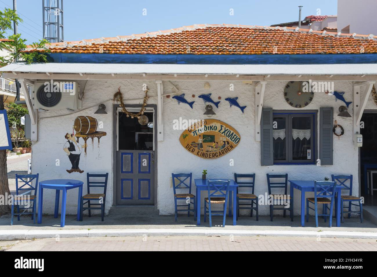 Mediterranean restaurant with murals, blue chairs and traditional ...