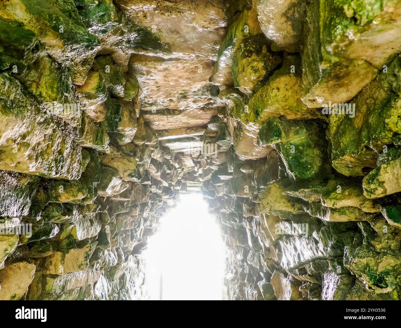 A Door in the wall entrance of the Tulum maya historical archeological ...