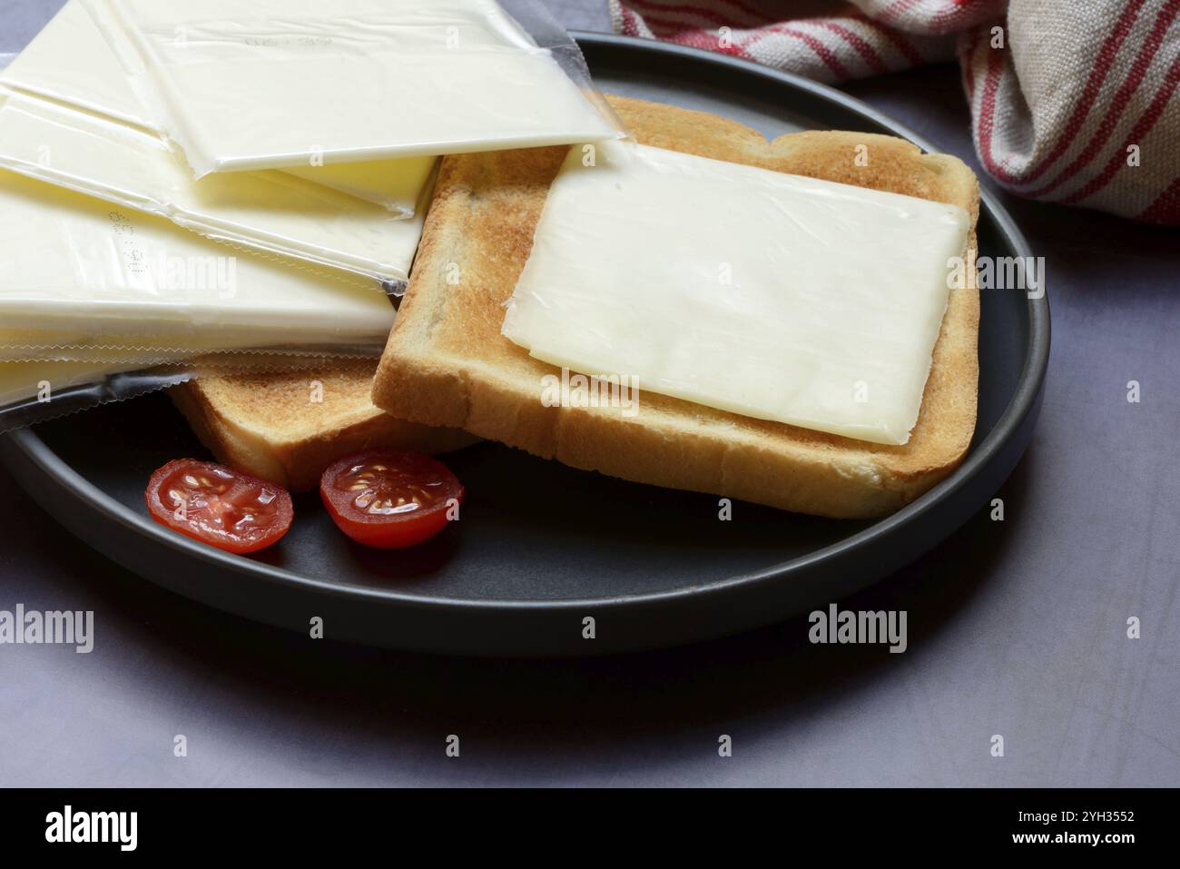 Cheese slices with toast, processed cheese in packaging Stock Photo - Alamy