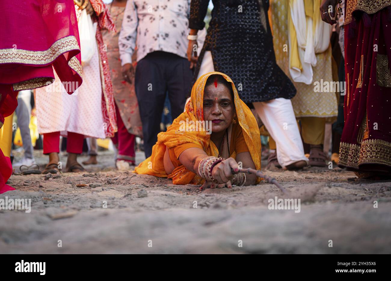 Hindu devotees perform rituals as they offer prayers to the Sun god in ...