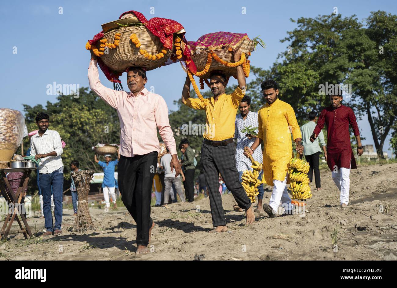 Hindu devotees perform rituals as they offer prayers to the Sun god in ...