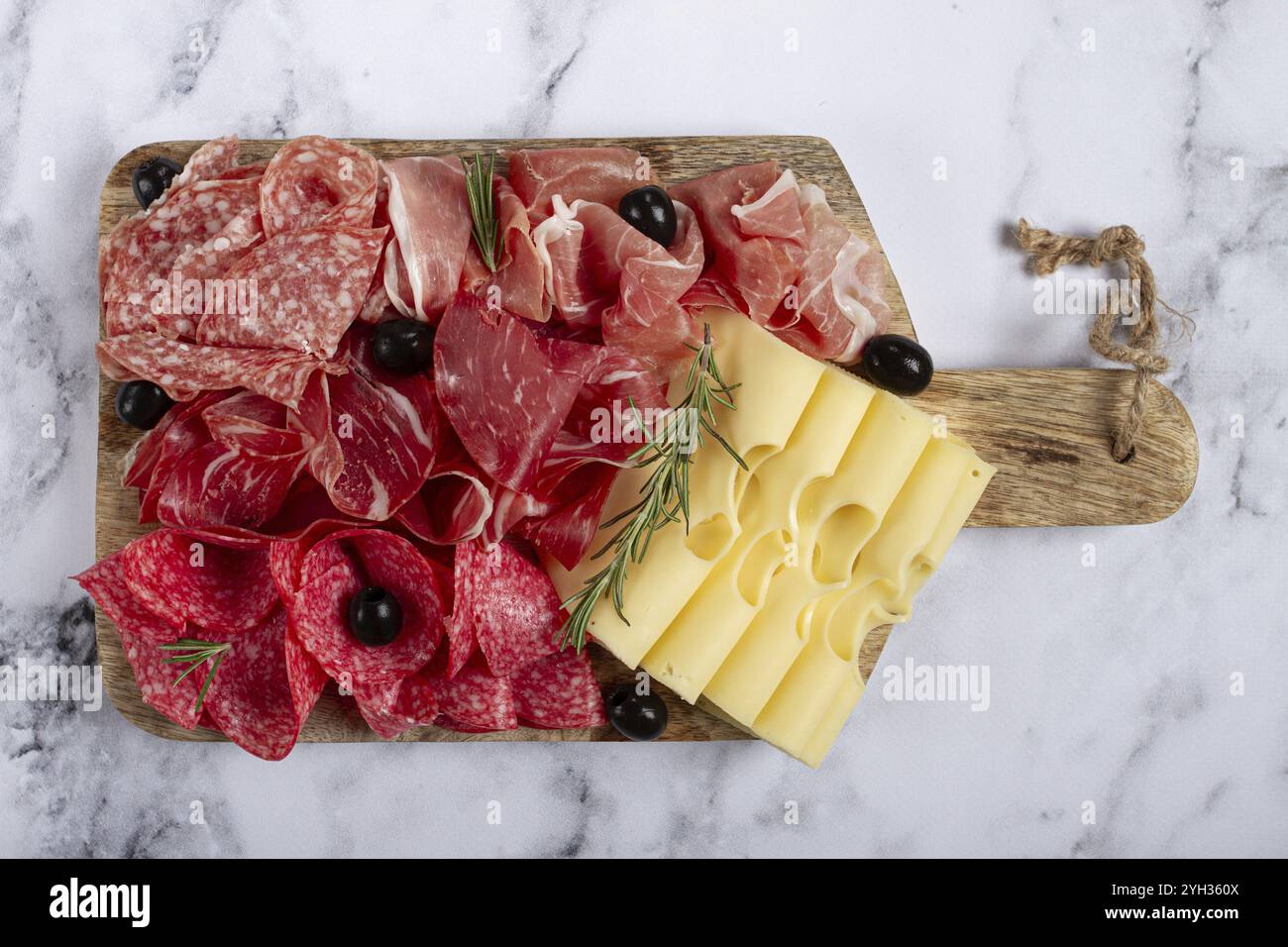 Assorted meat, appetizer, prosciutto, salami and ham, with maasdam ...