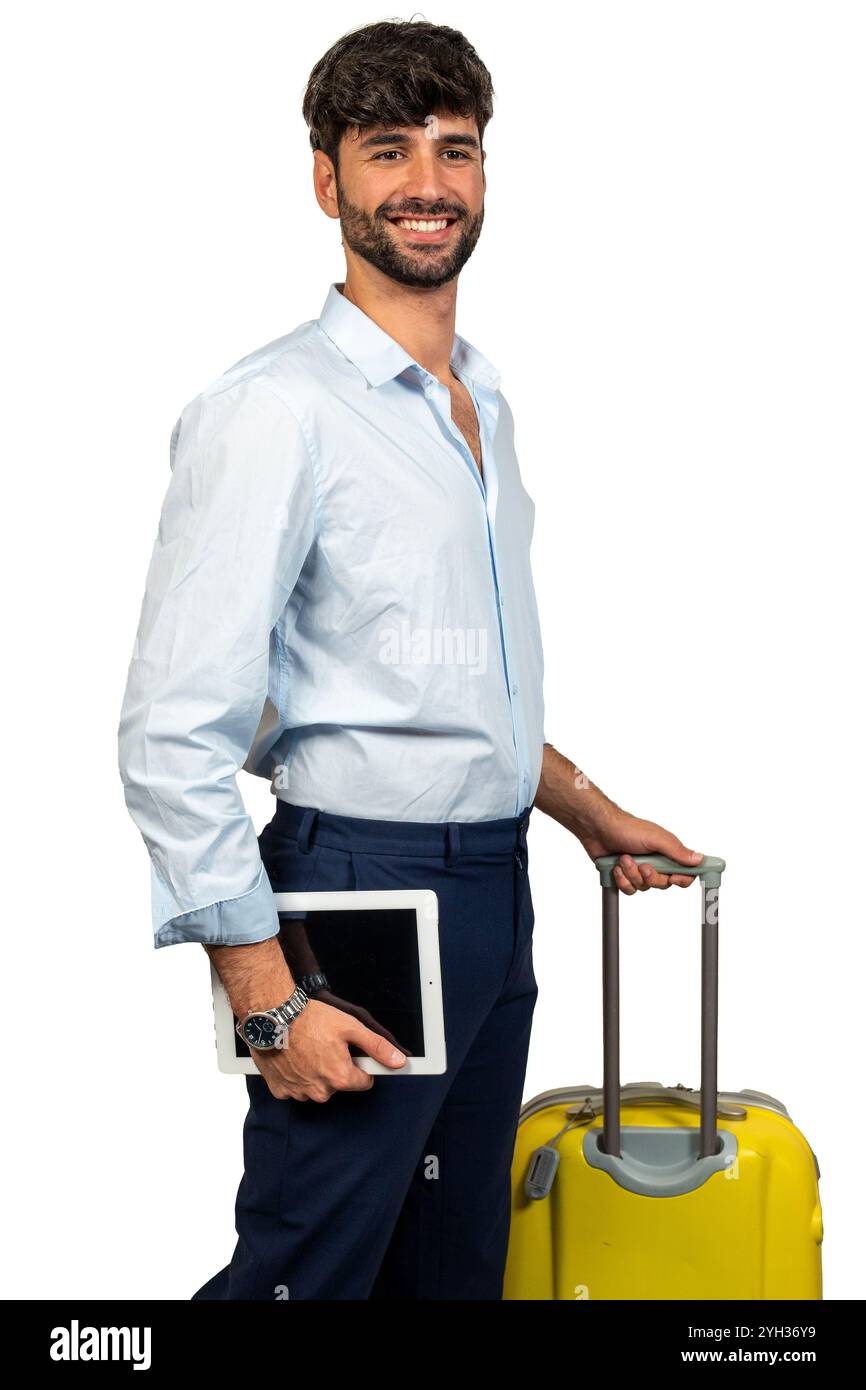 Businessman holding tablet and pulling suitcase, ready for business ...