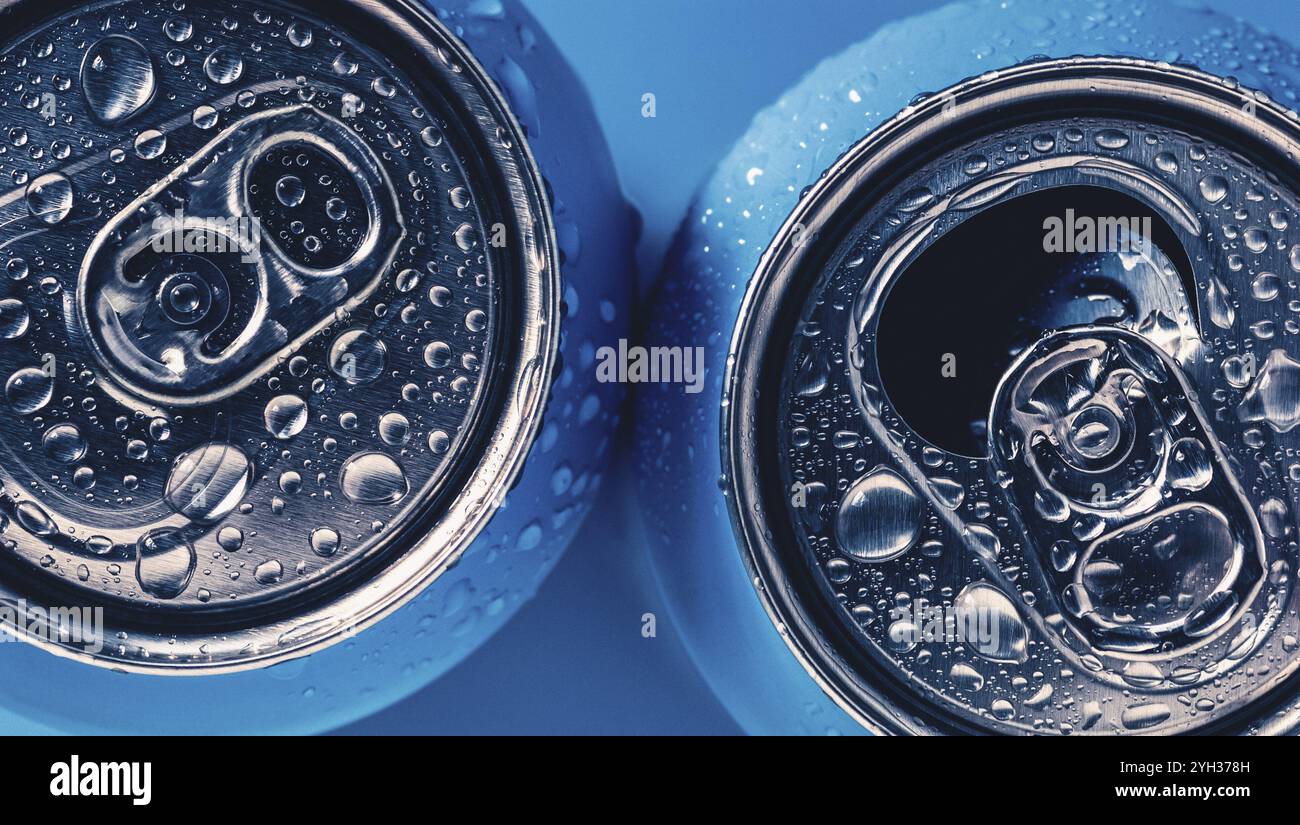 Two aluminum beer cans on blue background with water drops Stock Photo ...