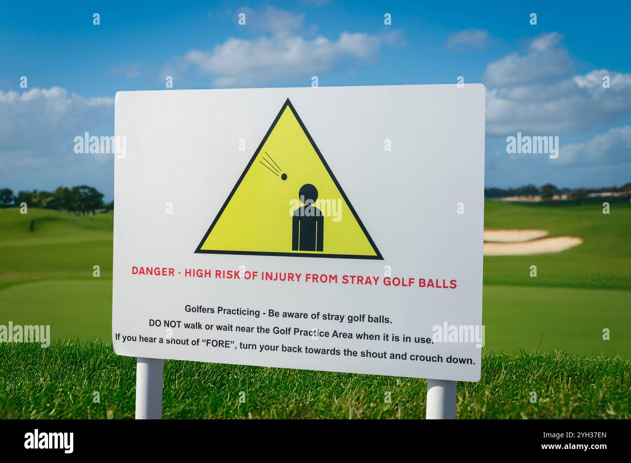 Warning stray golf balls danger sign Stock Photo - Alamy