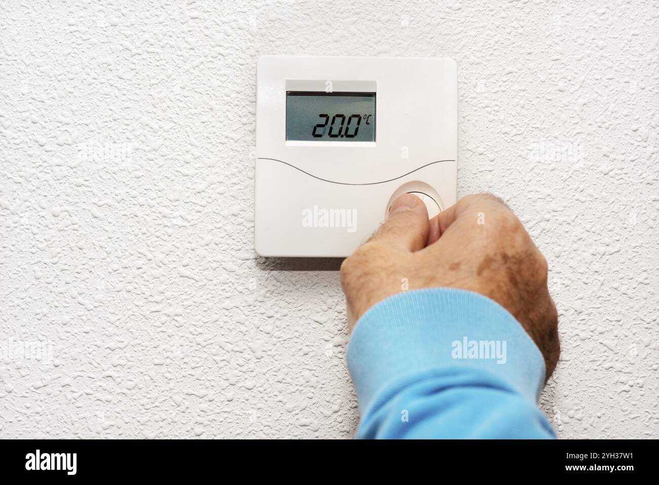Man adjusting temperature control hi-res stock photography and images ...