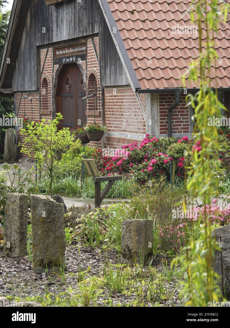 Bench in front of brick house hi-res stock photography and images - Alamy