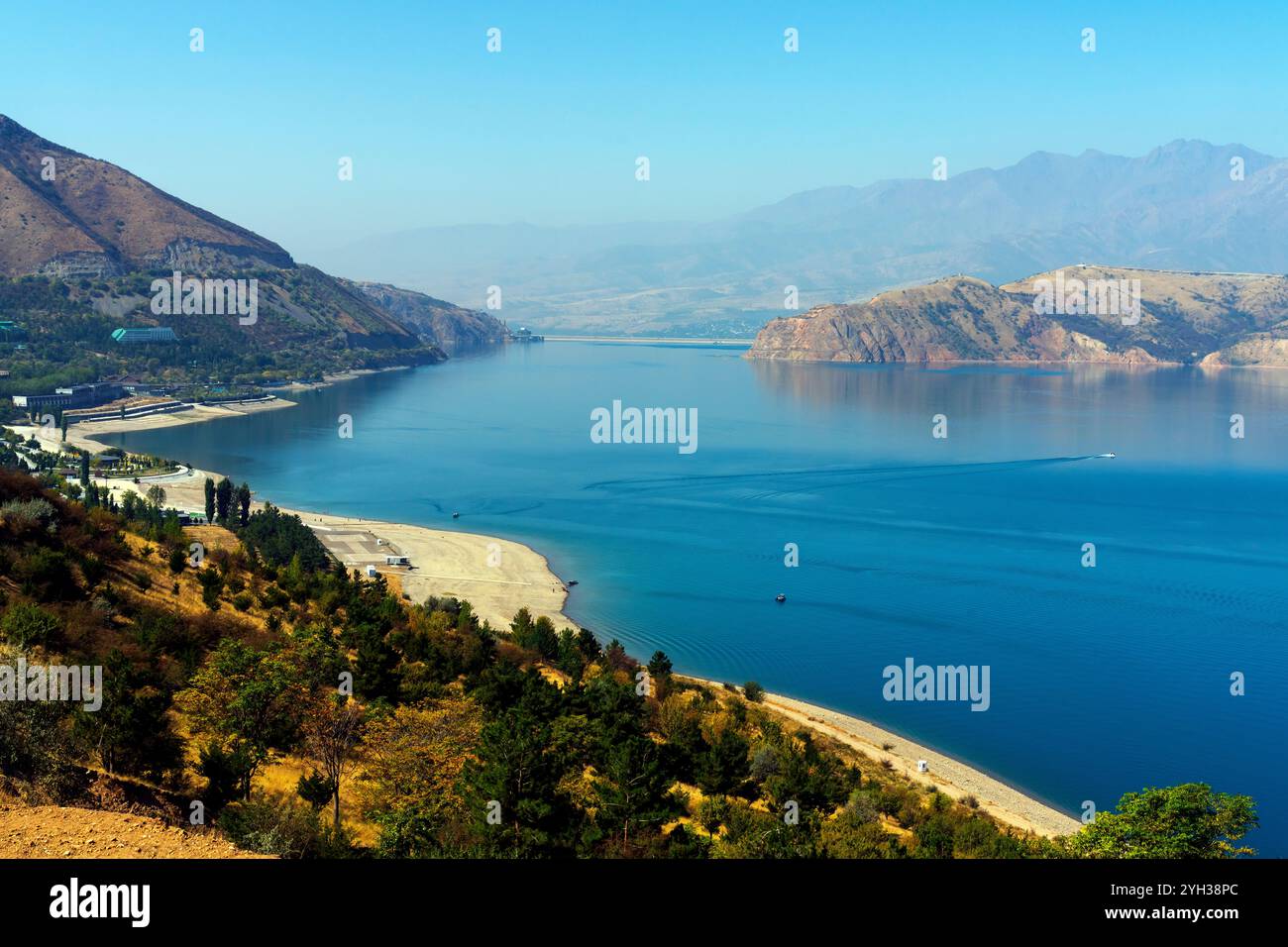 Charvak water reservoir surrounded by beuutiful mountain landscape is ...