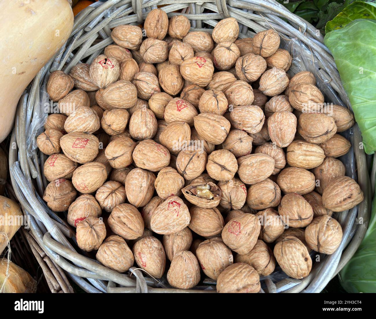 Basket of walnuts on display outside shop, Suffolk, England, UK Stock ...
