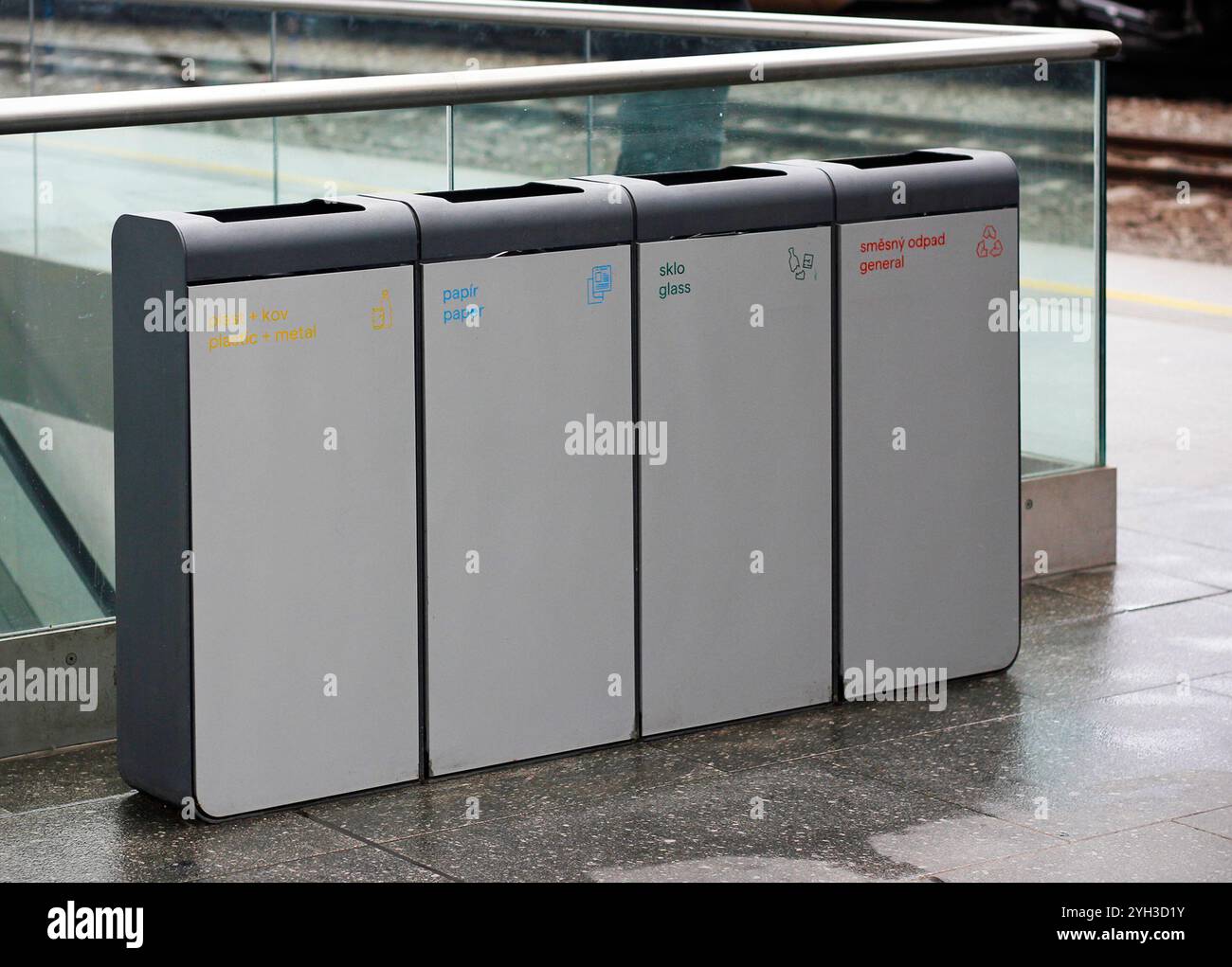 Four grey recycle trash cans with description in Czech and English on ...