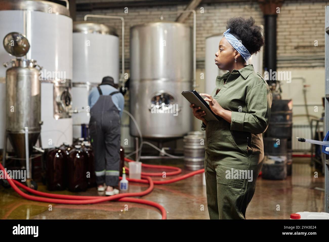 Side view of concentrated female African American process technician ...