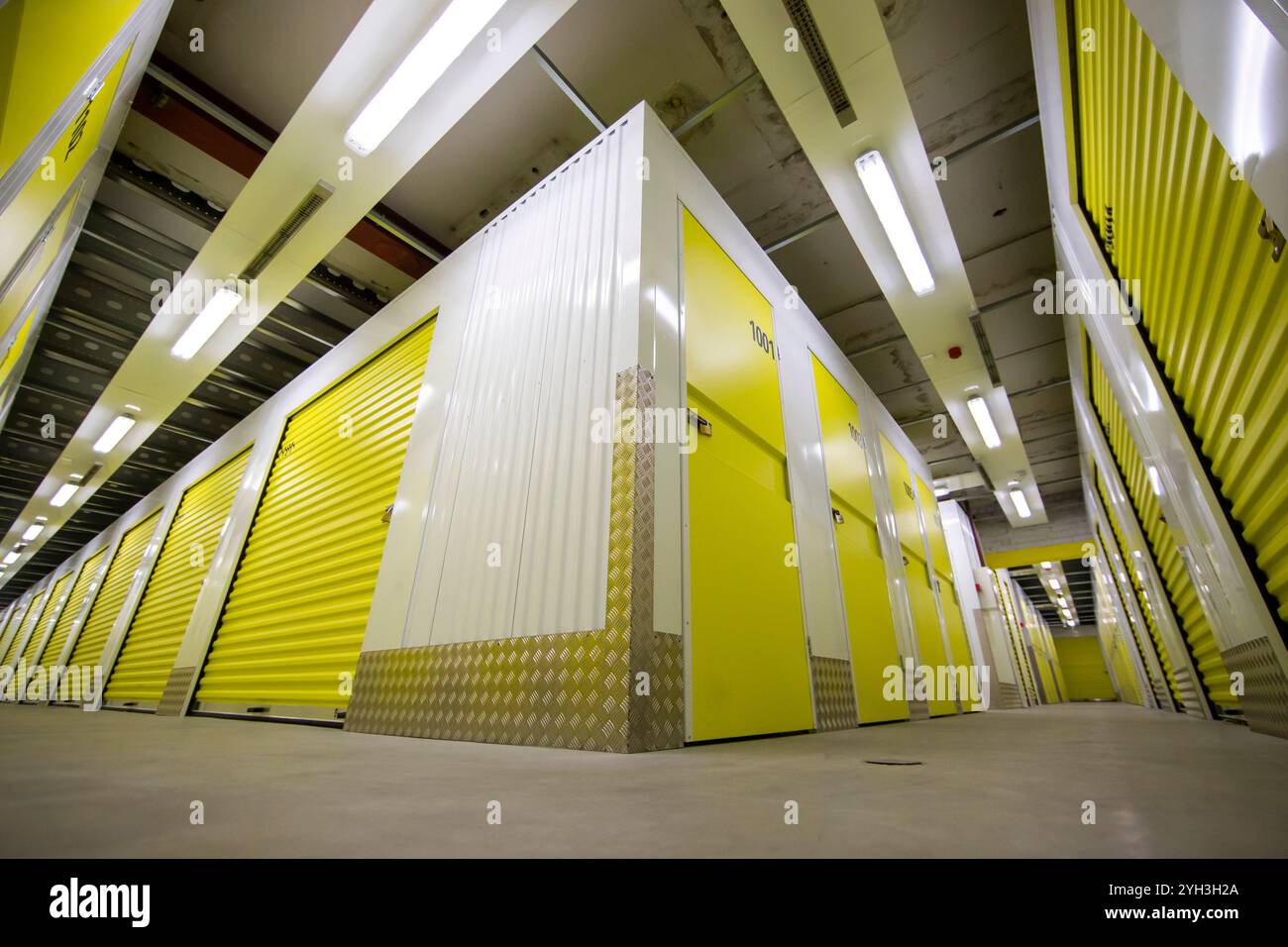 Modern storage facility interior with bright yellow doors, clean ...