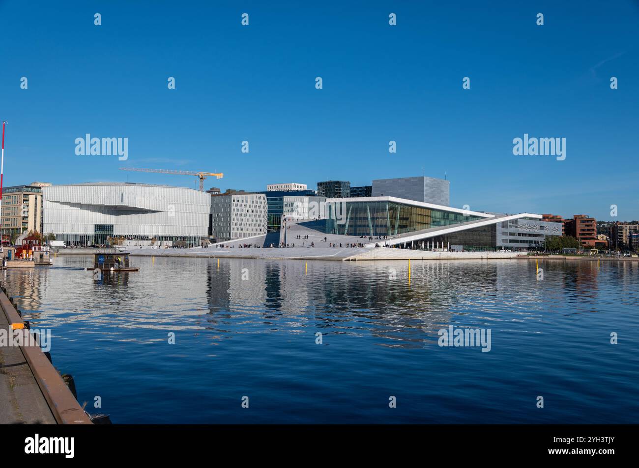 A modern skyline of Oslo and the harbour in Norway. The Opera House was ...