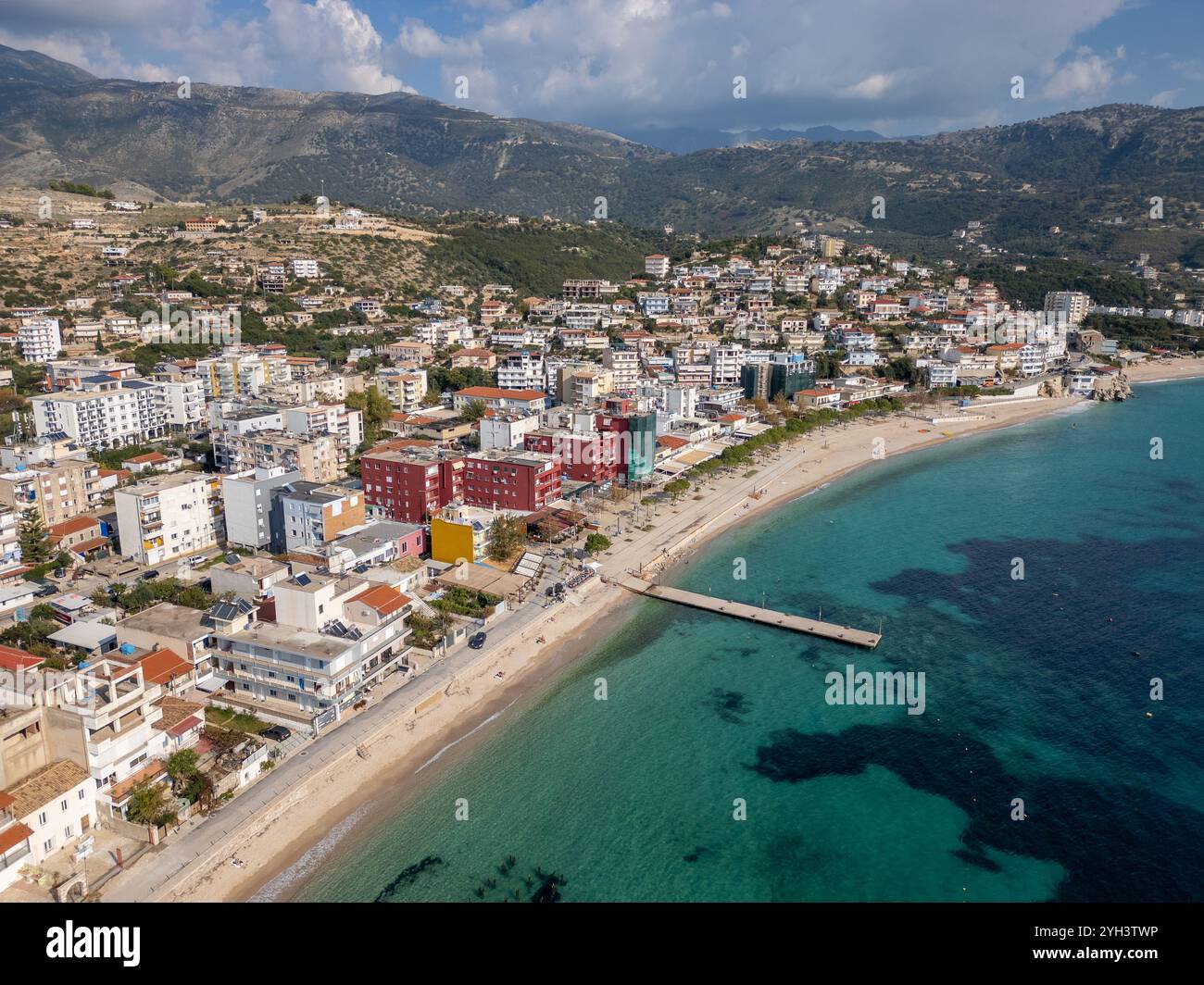 Aerial drone photo of the coastal town of Himarë in Albania. Himarë has ...