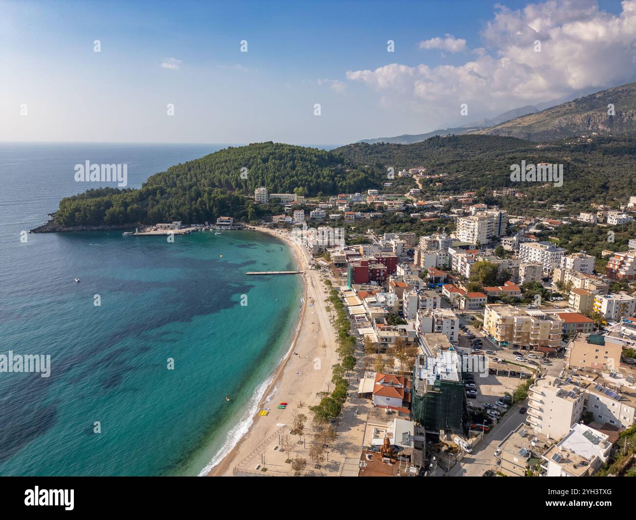 Aerial drone photo of the coastal town of Himarë in Albania. Himarë has ...