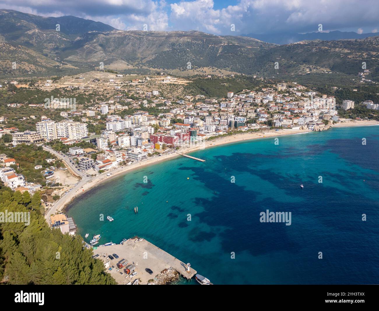 Aerial drone photo of the coastal town of Himarë in Albania. Himarë has ...