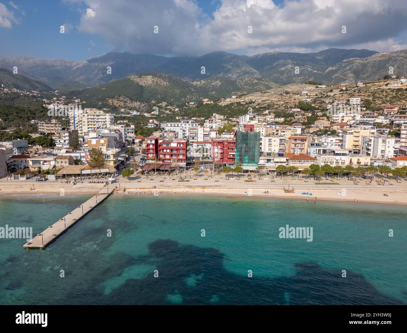 Aerial drone photo of the coastal town of Himarë in Albania. Himarë has ...