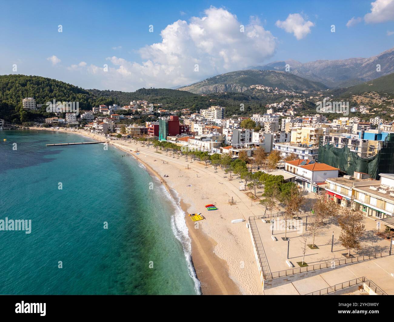 Aerial drone photo of the coastal town of Himarë in Albania. Himarë has ...