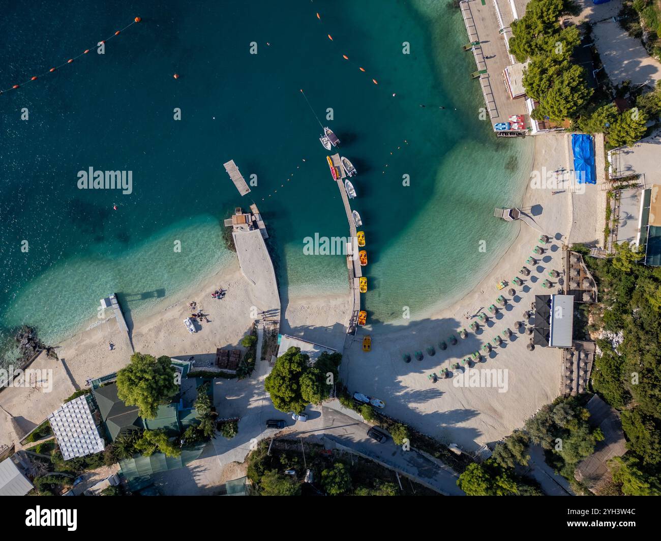 Aerial drone photo of the coastal town of Ksamil. Ksamil is a holiday ...