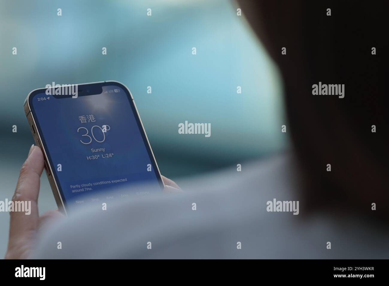 In this photo illustration, A woman browses Weather app to check ...