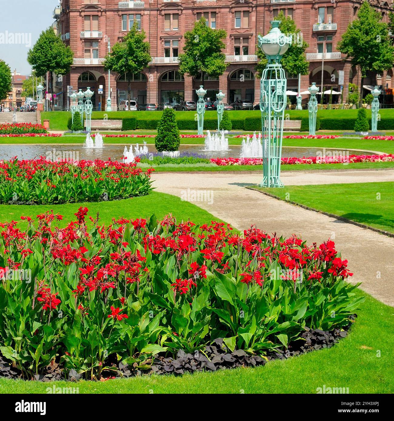 Beautiful cityscape with bright flower beds and lawns. Friedrichsplatz ...