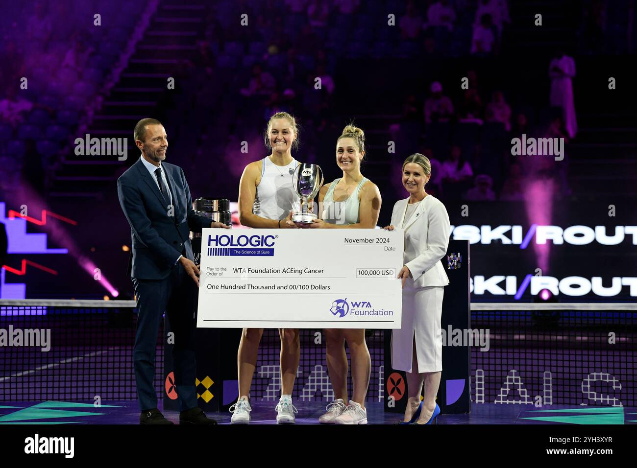 New Zealand's Erin Routliffe, left, and Canada's Gabriela Dabrowski hold their trophy and pose ...