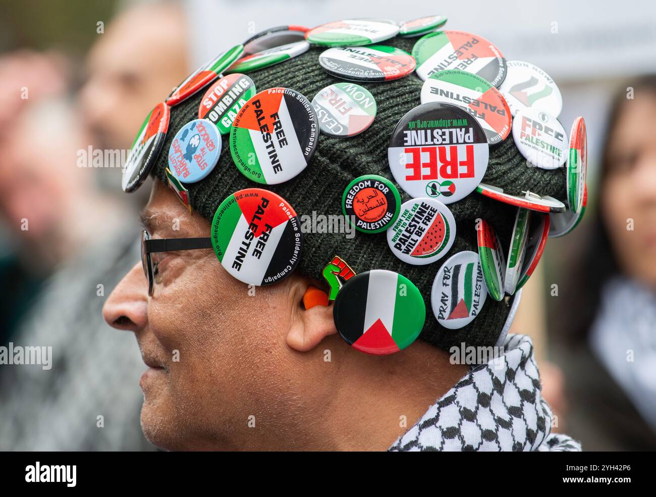 London, UK. 2nd Nov 2024. Pro Palestine supporter wearing hat with pin ...