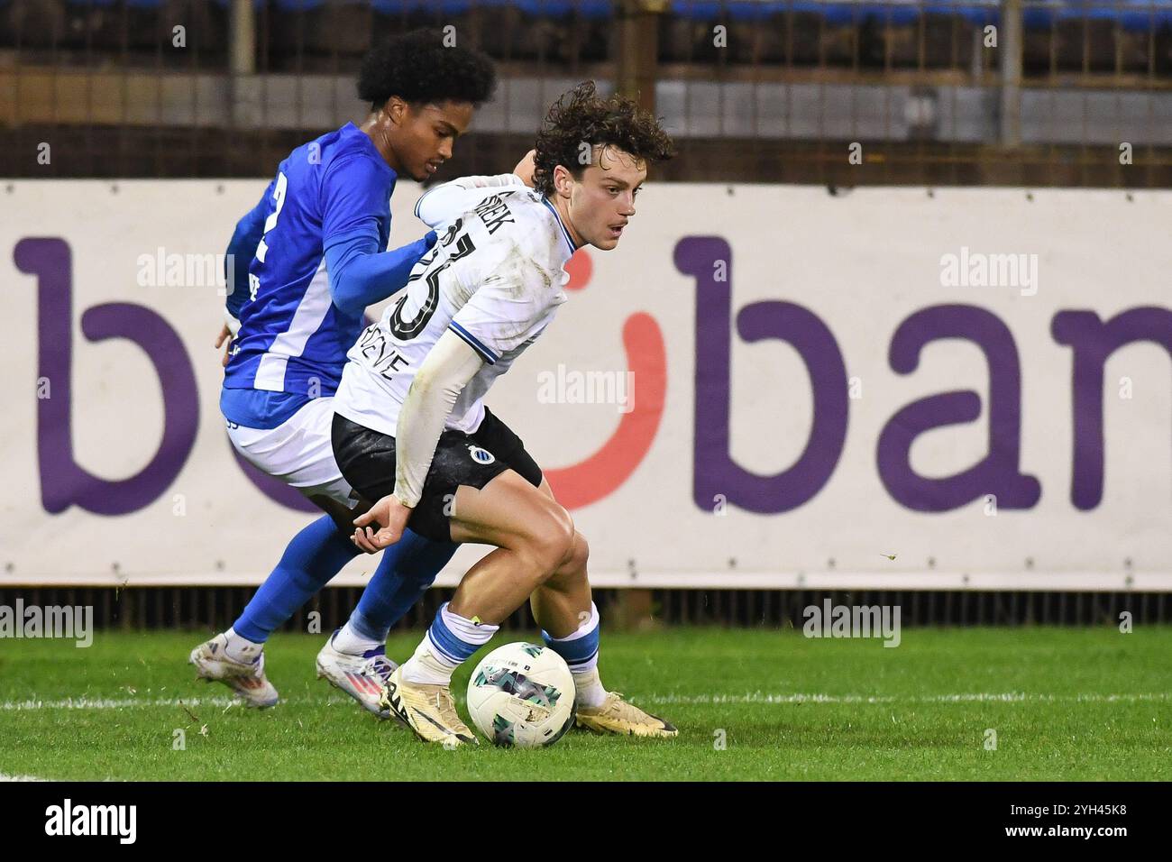 Genk's Pierre Kayden and Club's Denzel De Roeve pictured in action ...