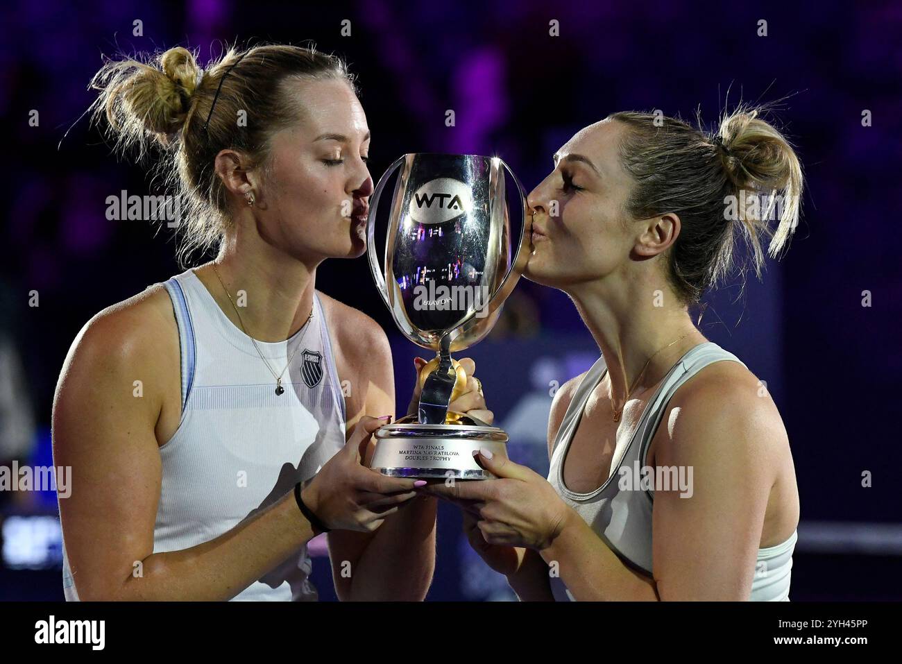 New Zealand's Erin Routliffe, left, and Canada's Gabriela Dabrowski kiss their trophy after ...