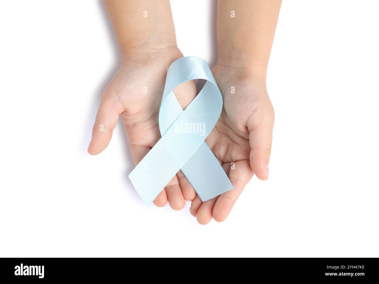 Child with light blue ribbon on white background, top view. Childhood ...
