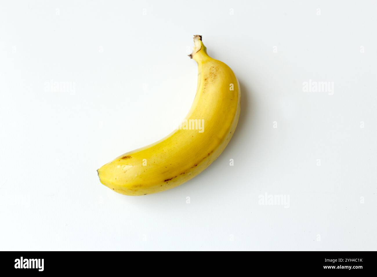 One dwarf banana fruit on white background. Vitamin rich organic ...