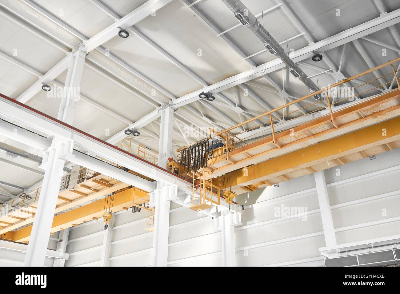Overhead cranes inside industrial building Stock Photo - Alamy