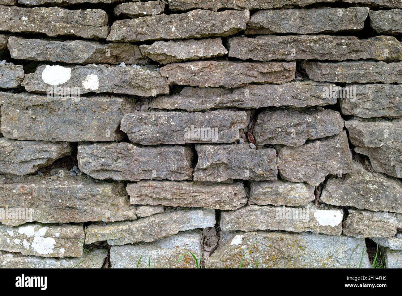 Wall section made of stacked stone slabs Stock Photo - Alamy