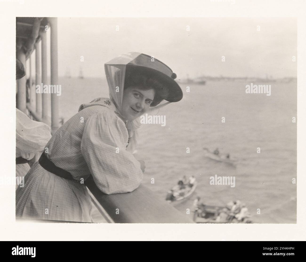 Portrait of woman cruise ship passenger, as it arrives in Caribean port ...