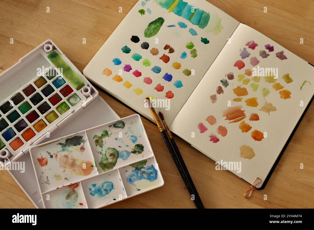 Artistic Workspace with Portable Watercolor Palette and Color Swatch ...